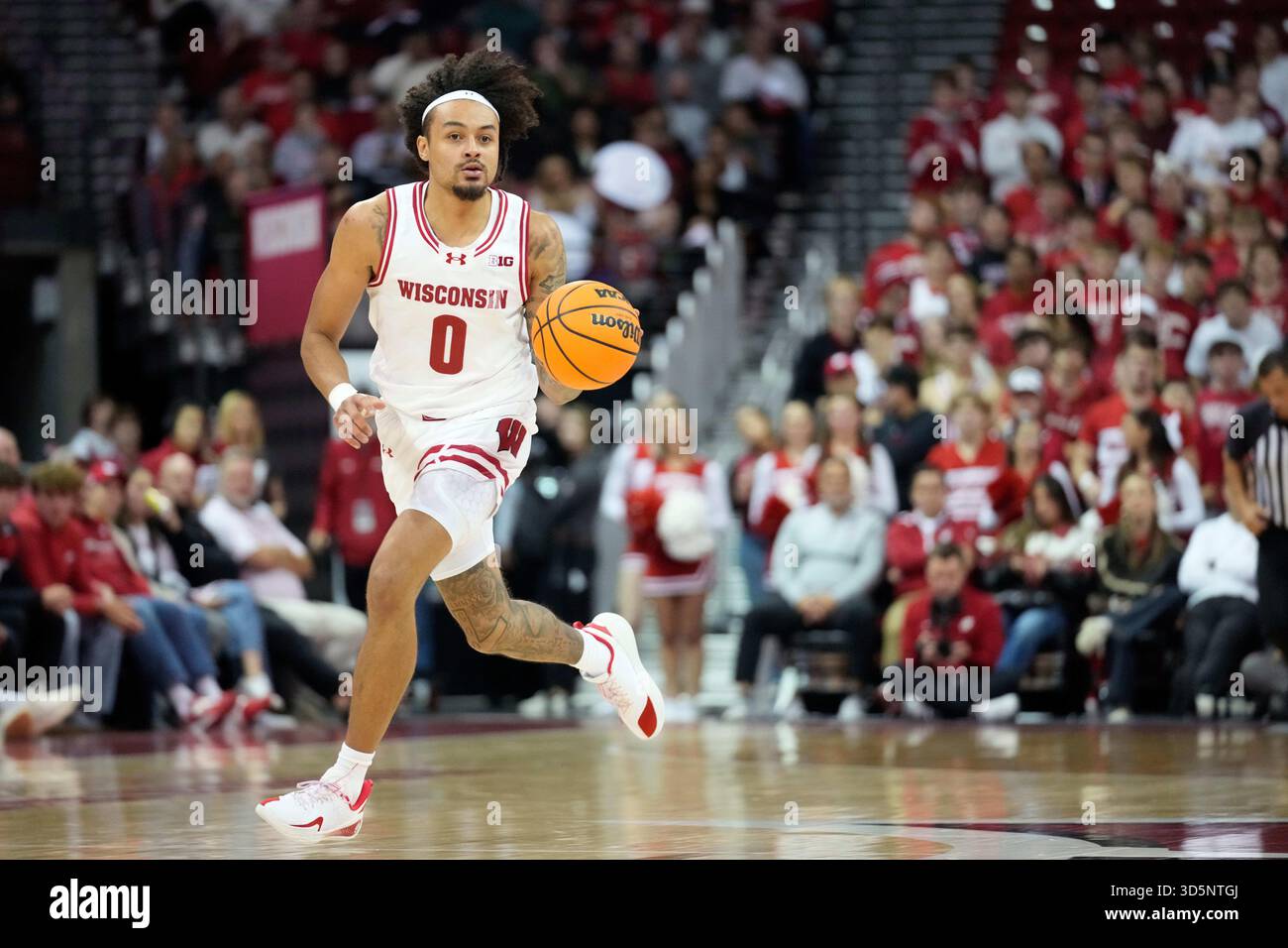Wisconsin guard Braeden Carrington dribbles the ball during the second ...