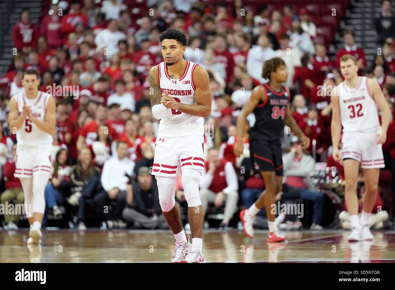 Wisconsin guard Nick Boyd, center, claps his hands while on defense ...