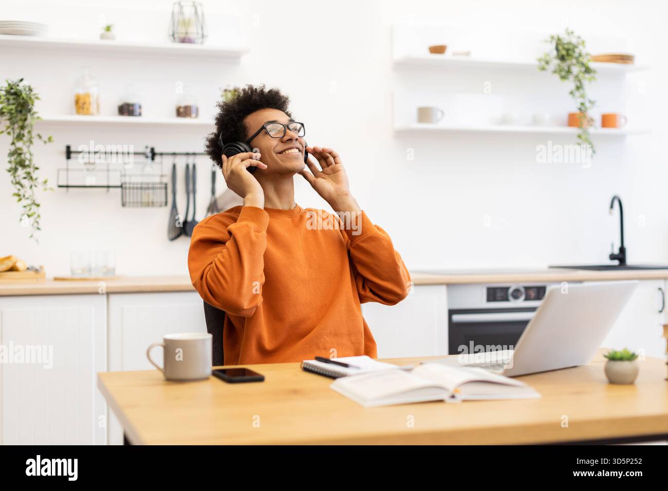 Relaxed african american student listening hi-res stock photography and ...