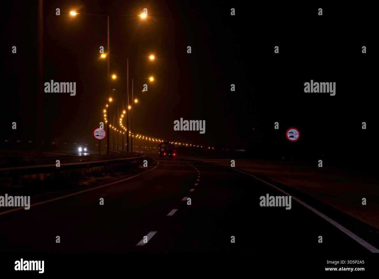Doha, Qatar - Photo of the Dukhan road, the night road is lit by ...