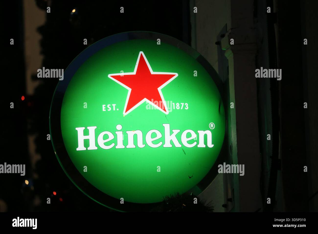 Dublin, Ireland - 12th November 2025 - A backlit green and Heineken ...