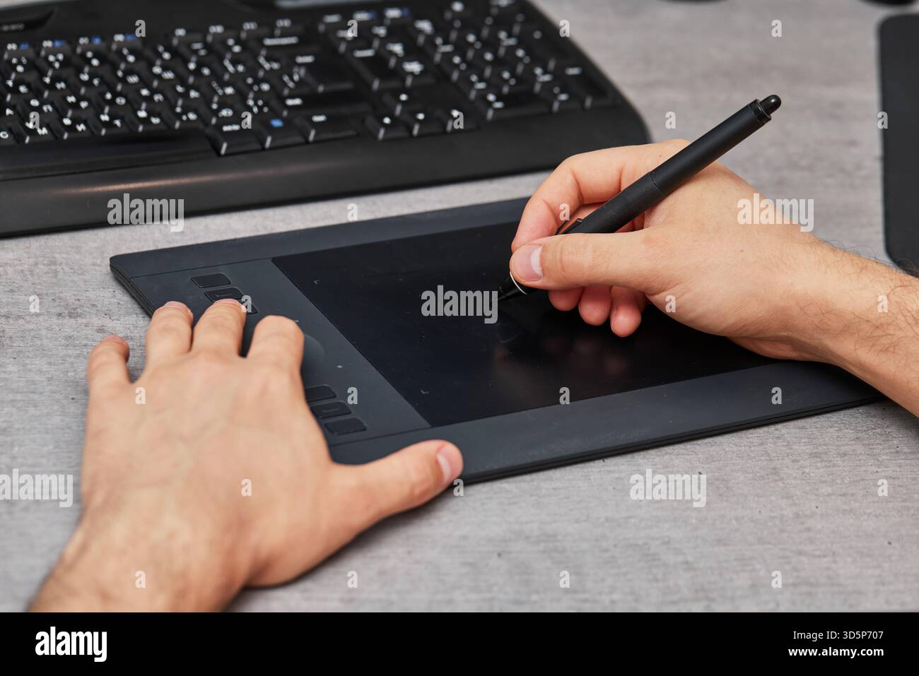 male hands drawing and retouching image on pc computer, using graphic ...