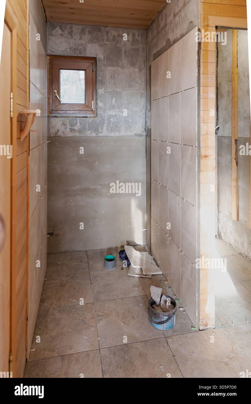 Bathroom renovation with ceramic tiles installation and construction ...