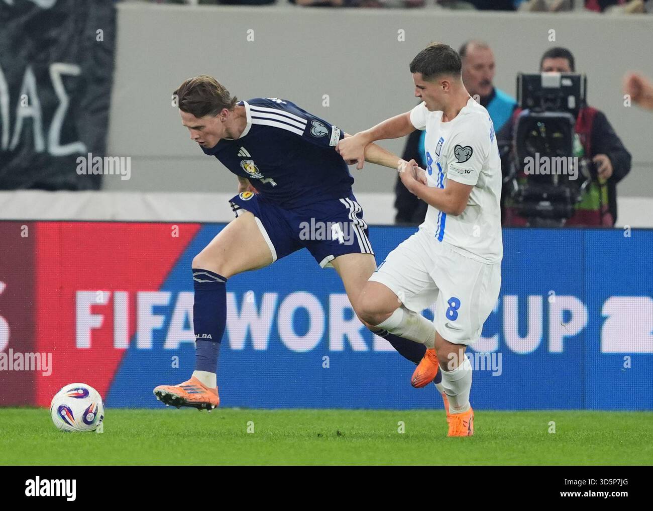 Scotland's Scott McTominay (left) challenges Greece's Christos ...