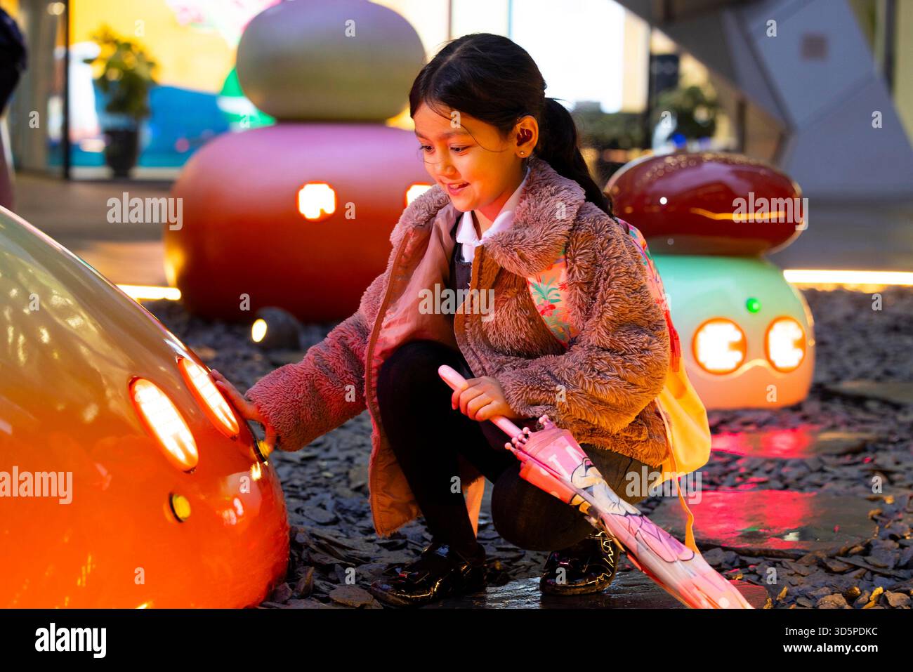 EDITORIAL USE ONLY Mahania aged 7 looks at Rock Monk Orchestra by art ...