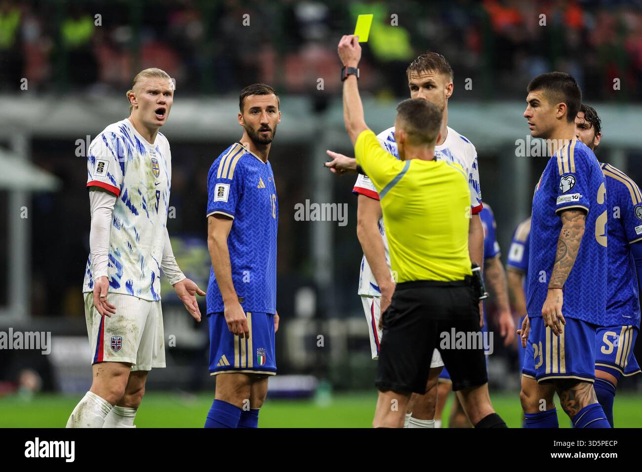 Referee Alejandro Hernandez shows a yellow card to Erling Haaland of ...