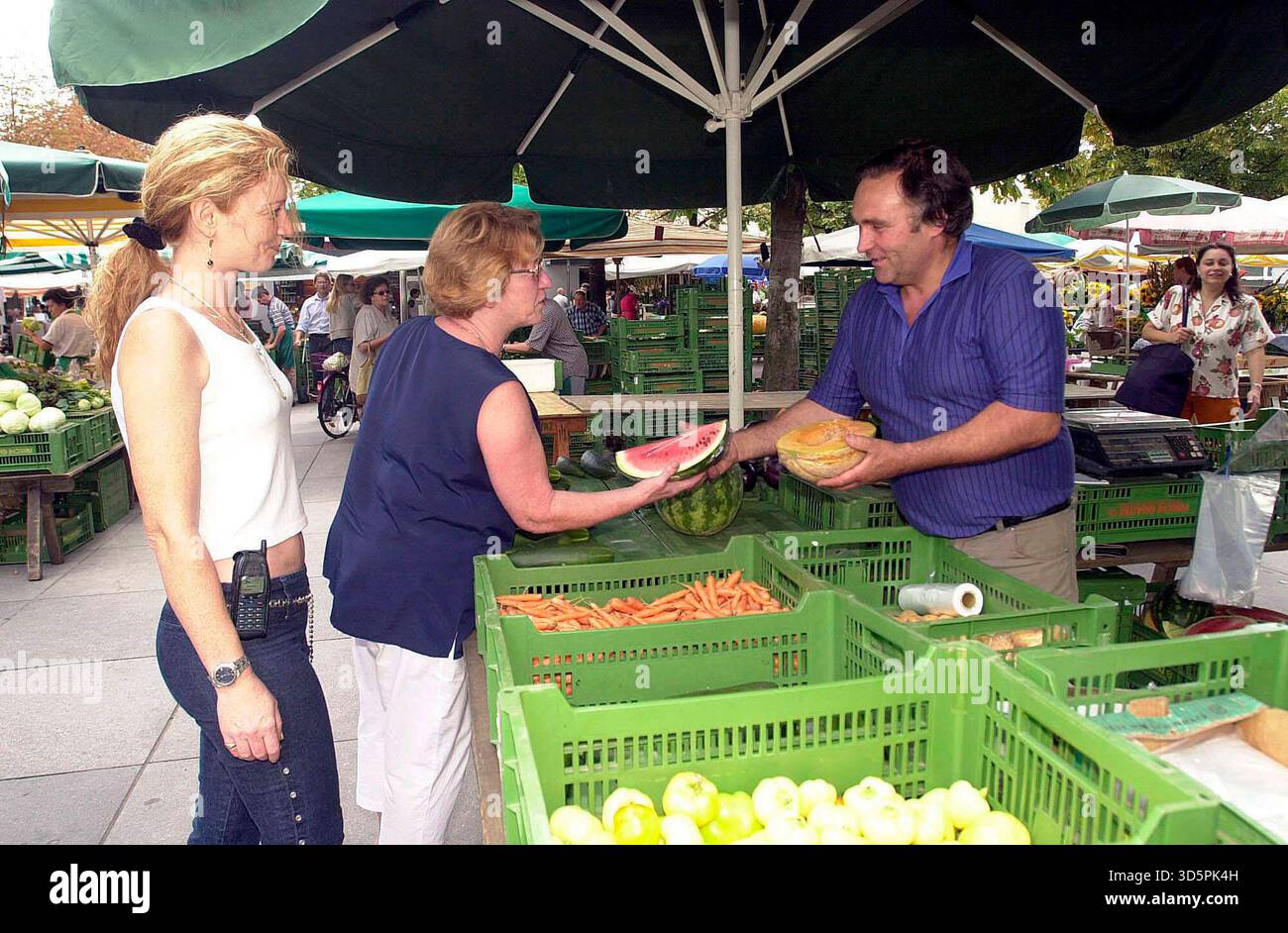 Vegetable sale at the market stall, farmer selling agricultural goods ...