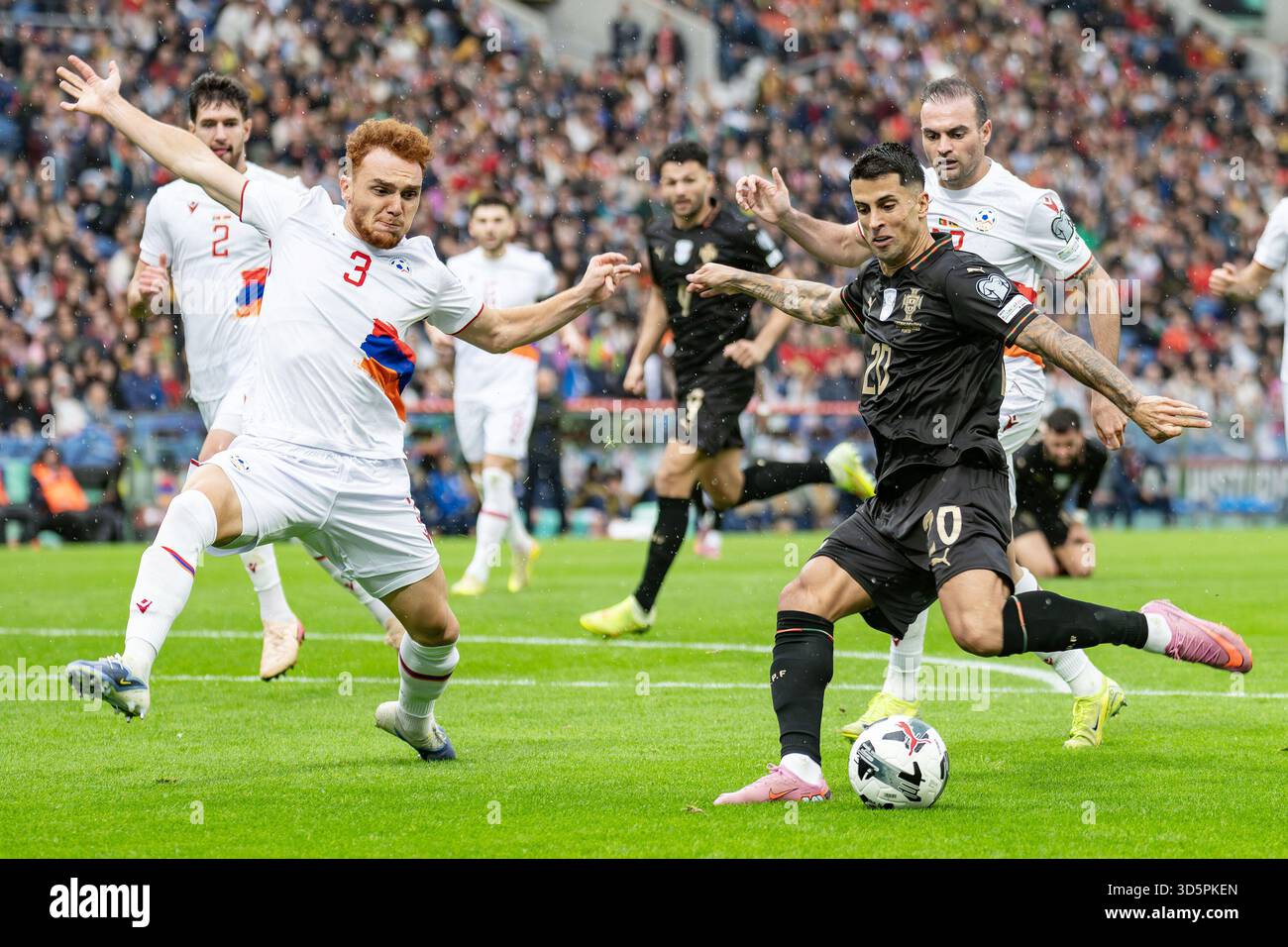 João Cancelo of Portugal and Erik Piloyan of Armenia during the FIFA ...