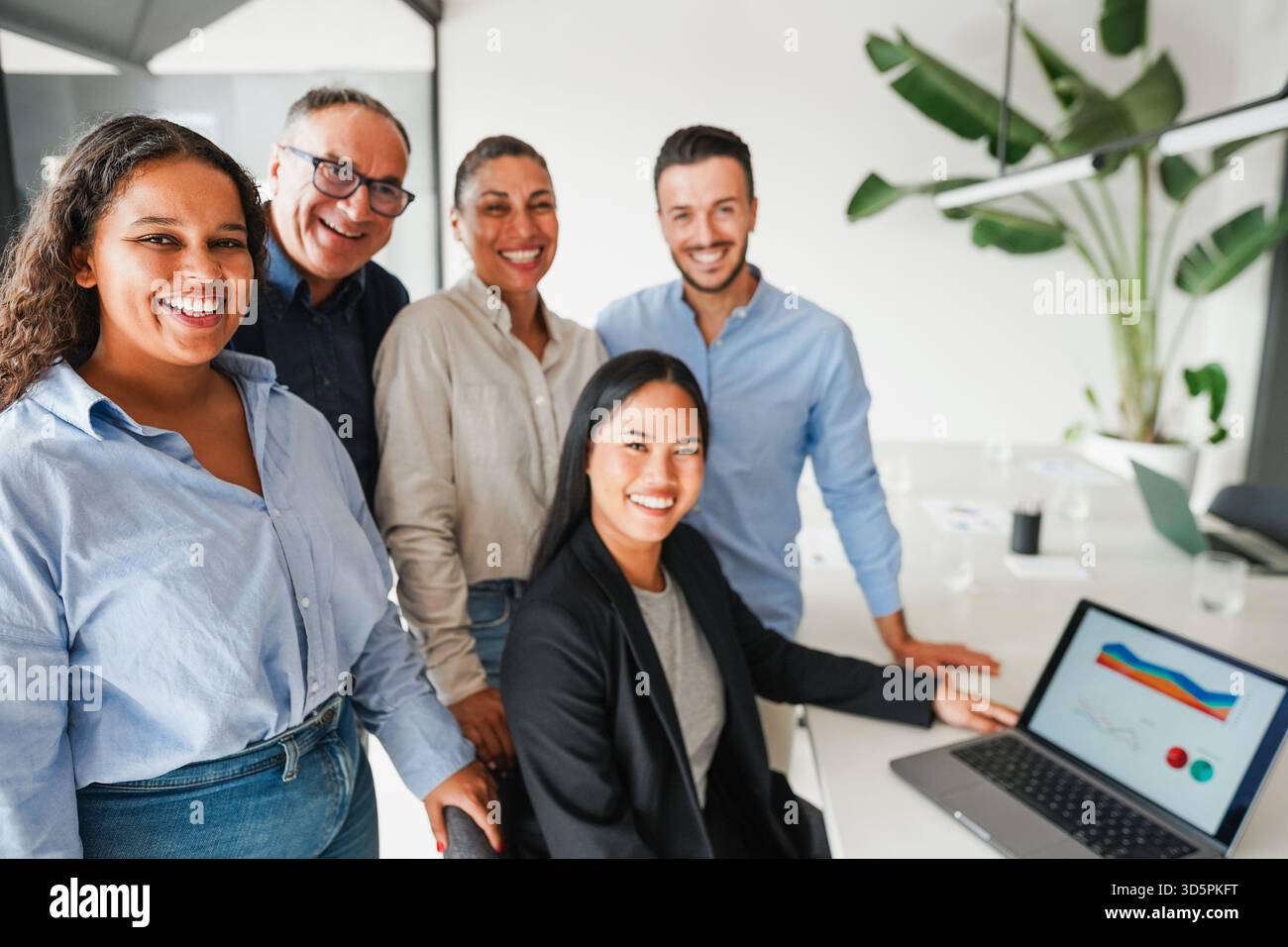Multiracial business people smiling on camera inside company office ...