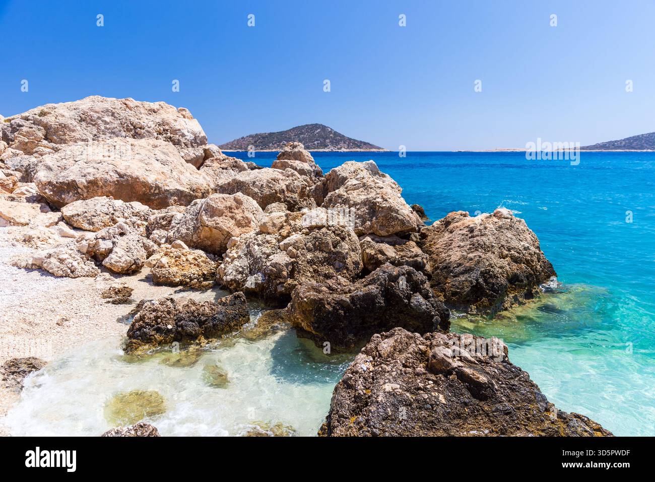 Coastal scene showcasing turquoise water and rocky formations under a ...