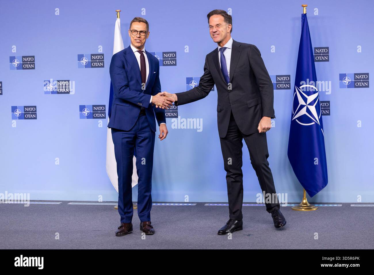 NATO Secretary General Mark Rutte, right, greets Finland's President ...