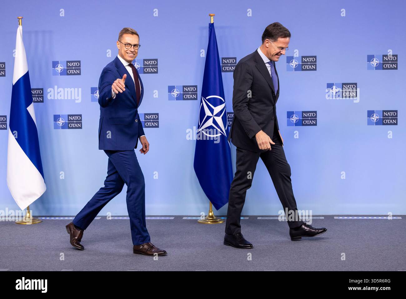 NATO Secretary General Mark Rutte, right, greets Finland's President ...