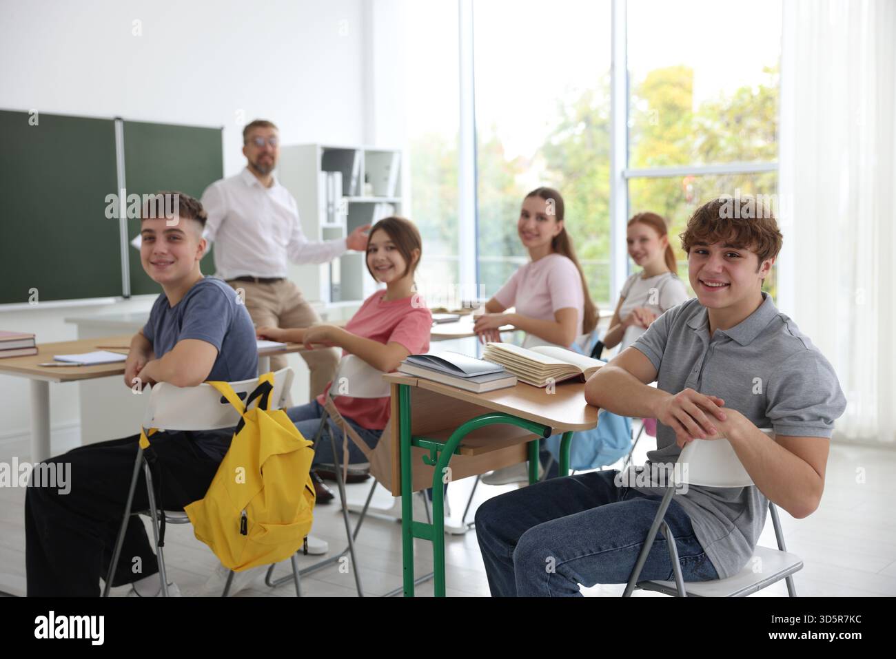 Teacher and students during lesson in classroom, selective focus Stock ...
