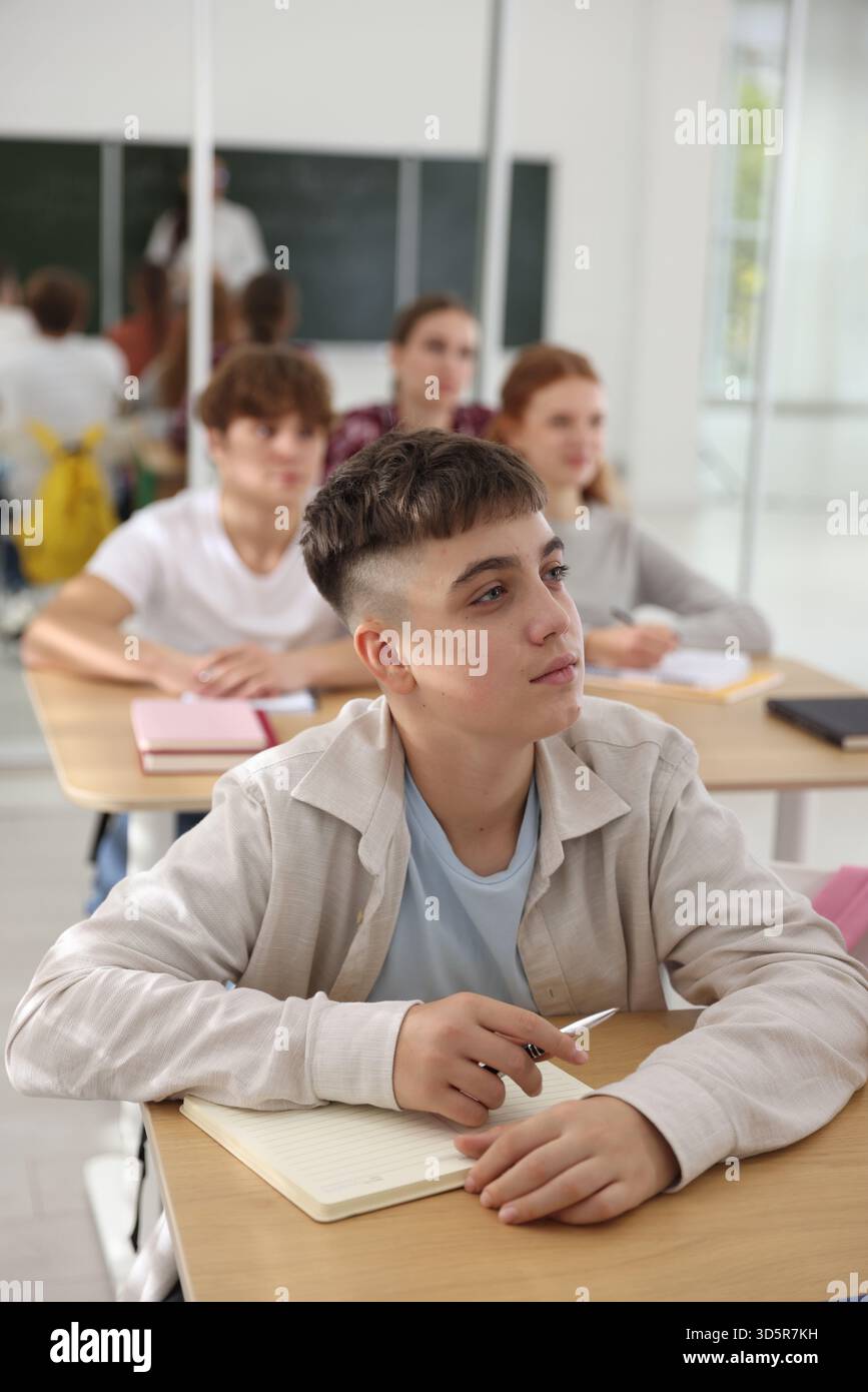 Teacher and students during lesson in classroom, selective focus Stock ...