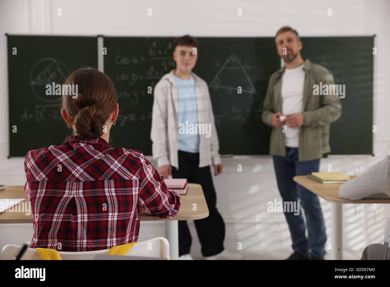 Teacher and students during lesson in classroom, selective focus Stock ...