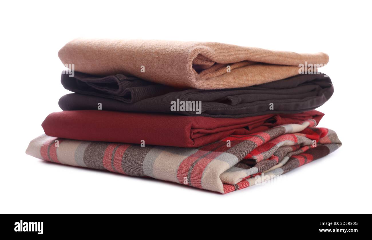 Stack of clean clothes isolated on white Stock Photo - Alamy