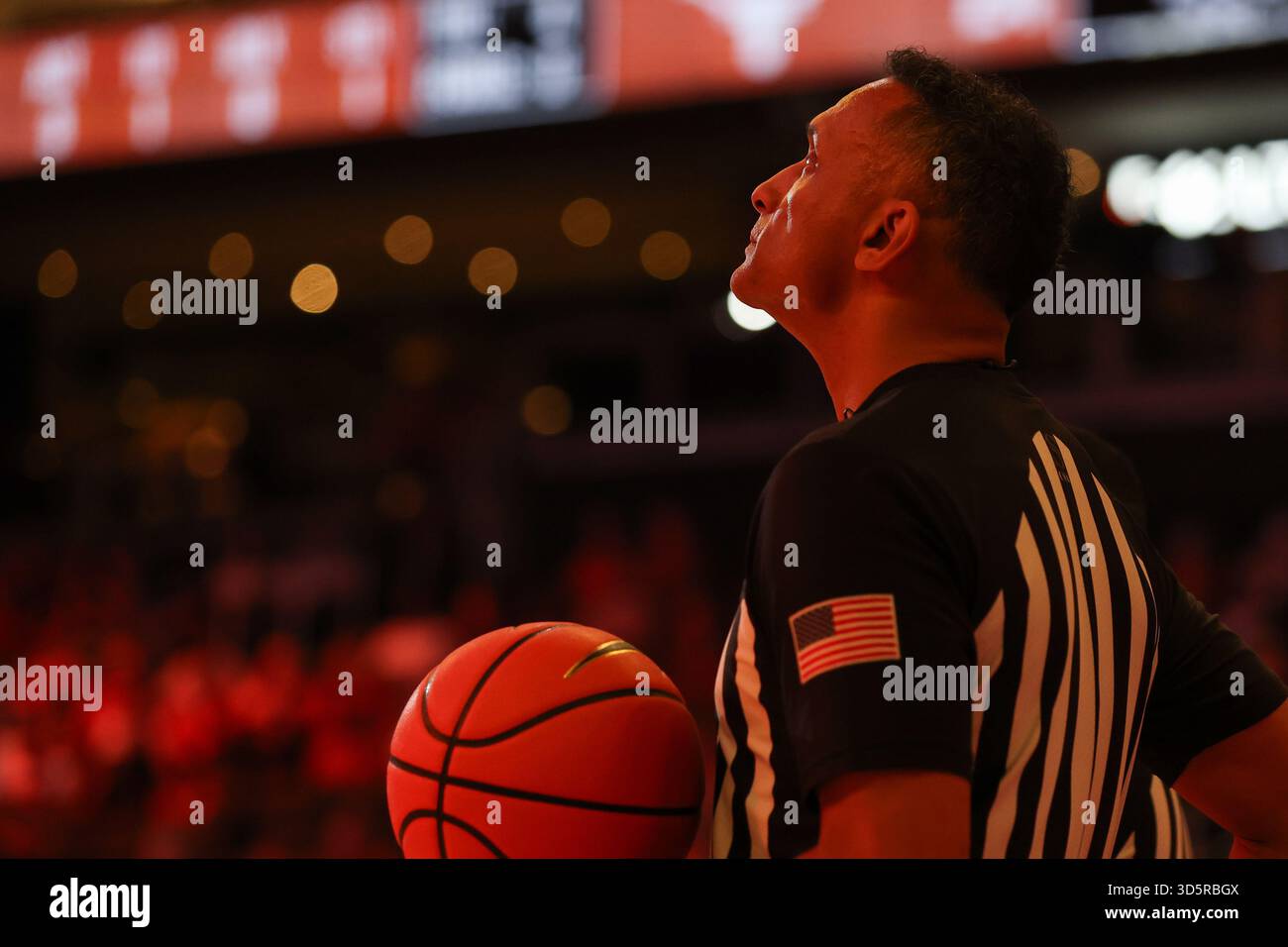 AUSTIN, TX - NOVEMBER 15: A referee holds the ball during a timeout of ...