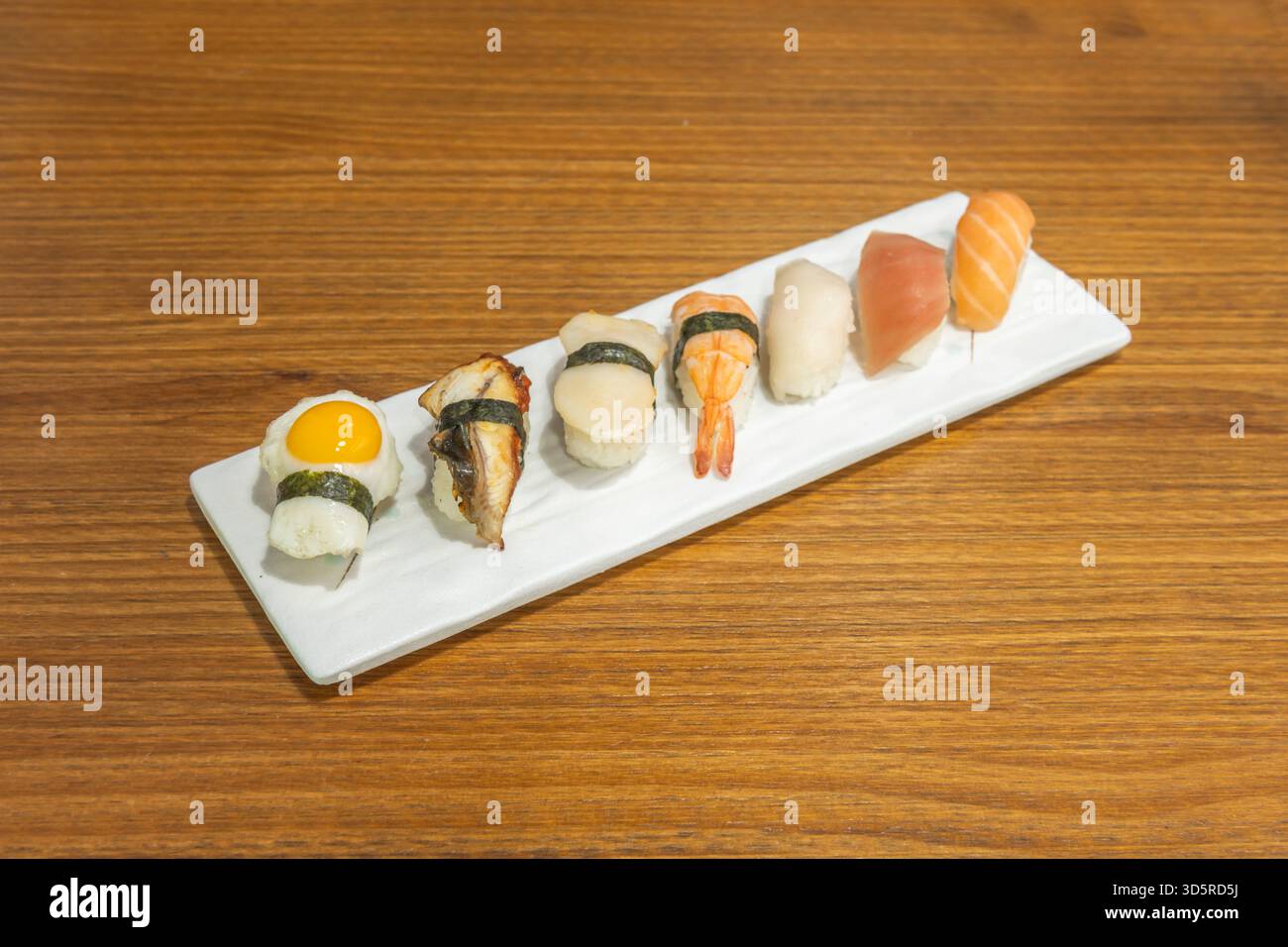 Ebi shrimp nigiri with a whole, lightly flattened cooked tiger prawn on ...
