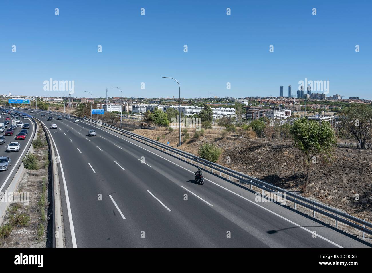 Intercity highway with heavy traffic where 10. Freight trucks mingle ...