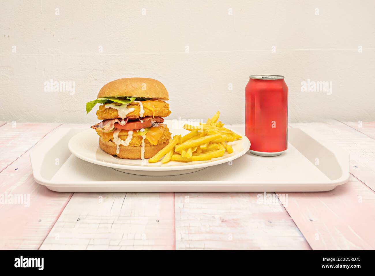 Crispy chicken burger with crispy maple bacon, poached egg, and lemon ...