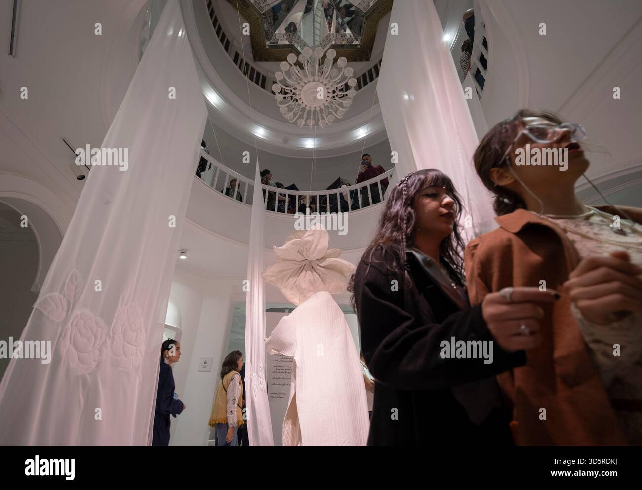 Young Iranian women attend a gallery to visit an interactive fashion ...