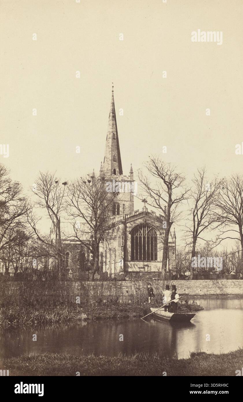 Shows a church viewed from a riverbank, including water reflections ...