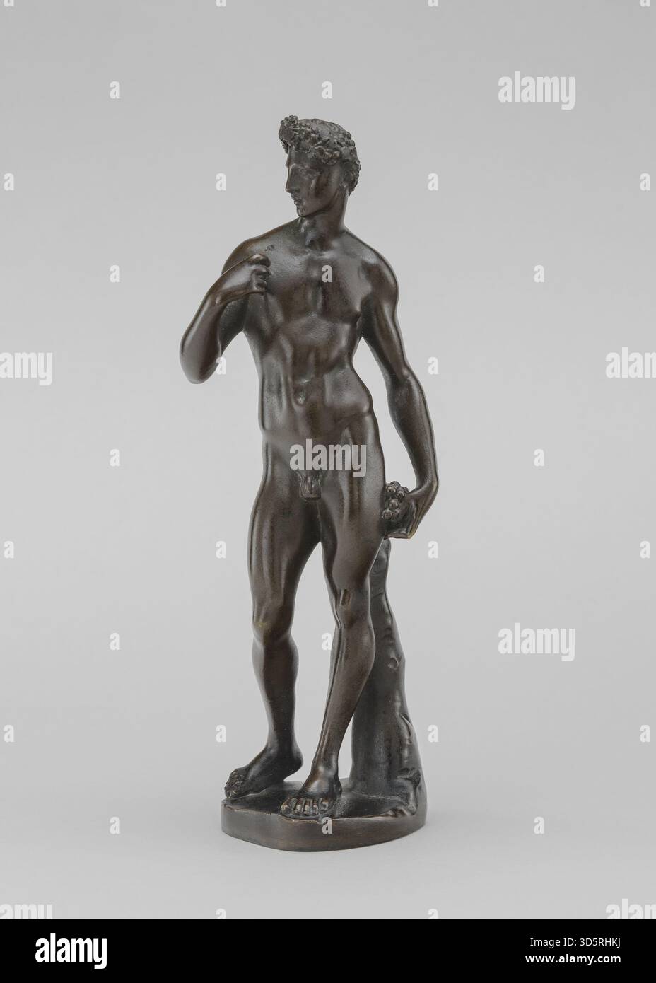 This sculpture represents Bacchus, the Roman god of wine, depicted with ...