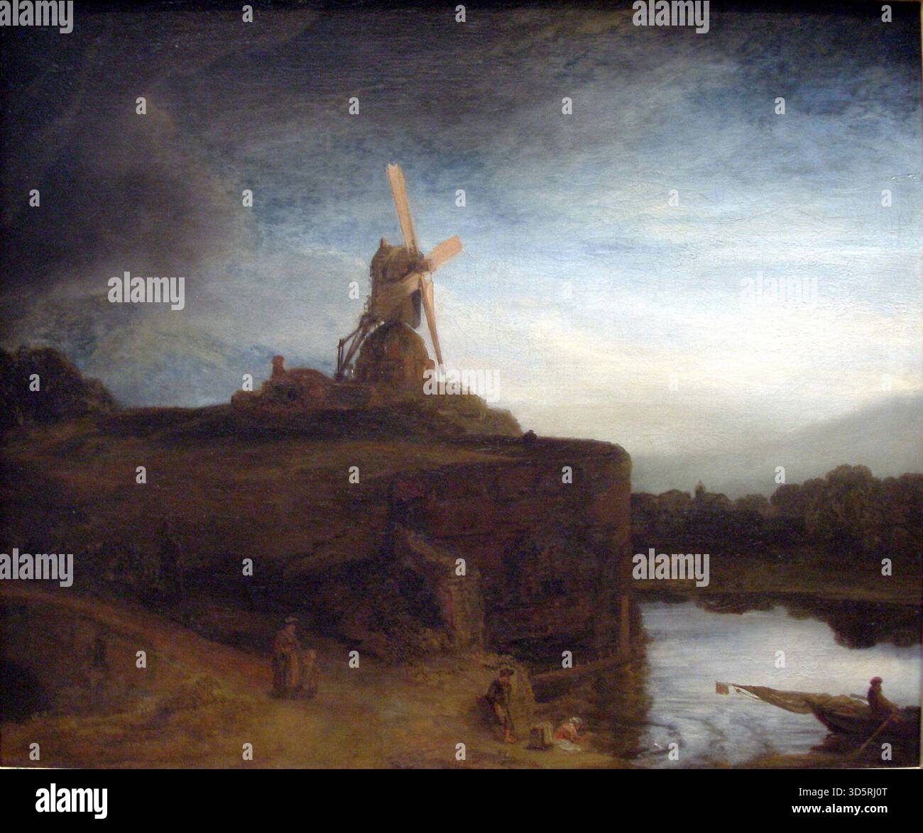 Rembrandt van Rijn's The Mill depicts a windmill beside a river with ...