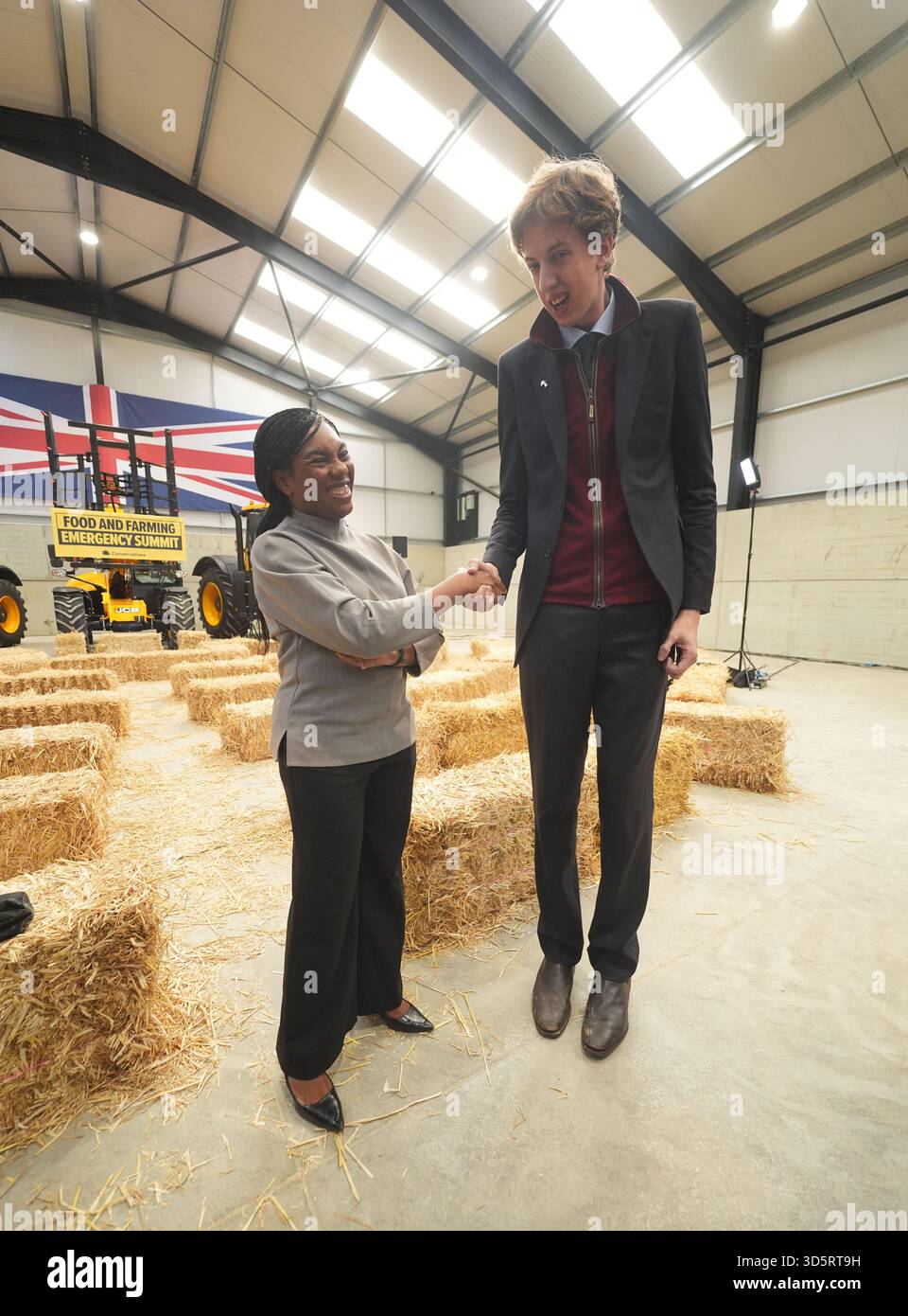 Conservative Party leader Kemi Badenoch speaks to student James ...