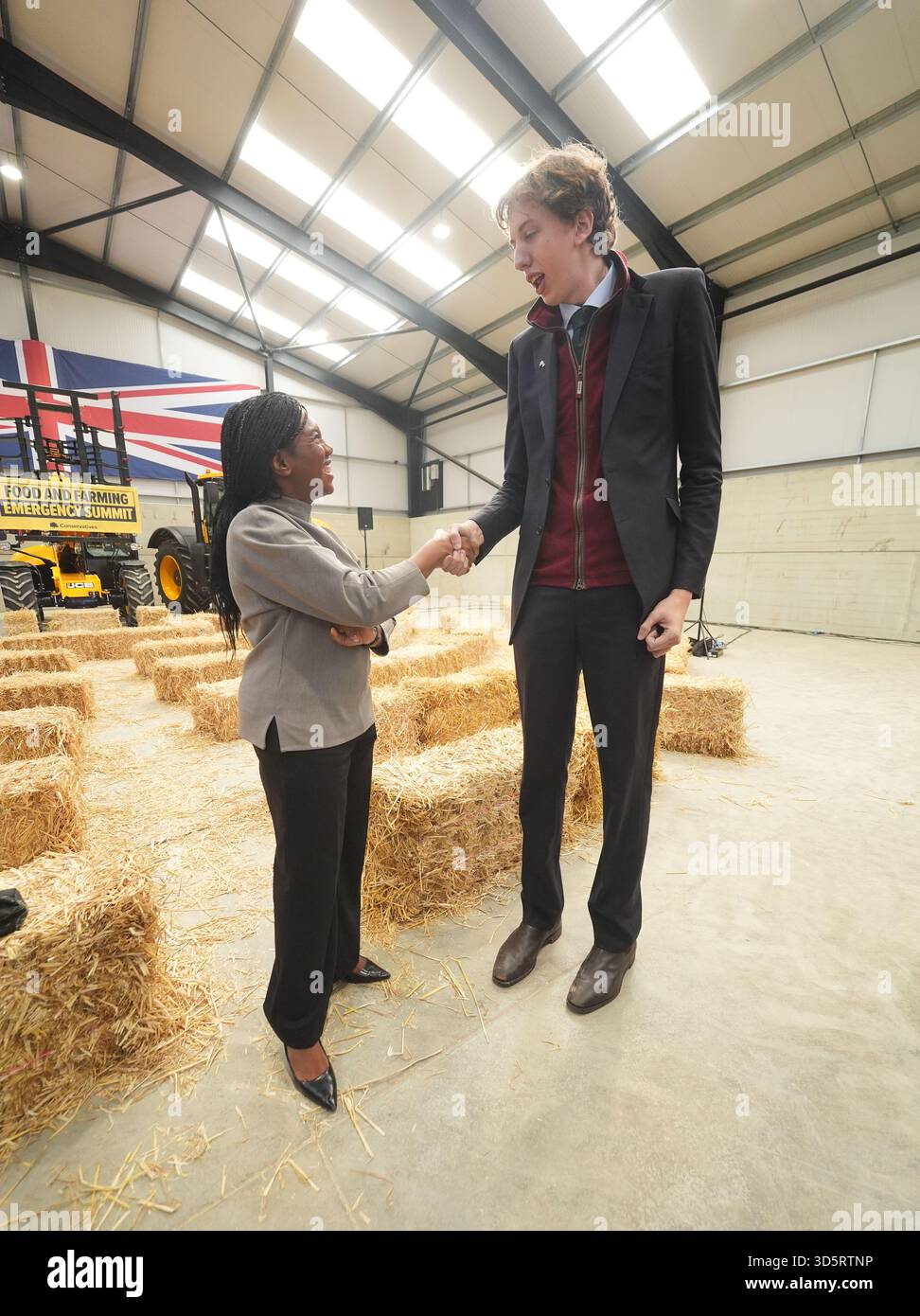 Conservative Party leader Kemi Badenoch speaks to student James ...