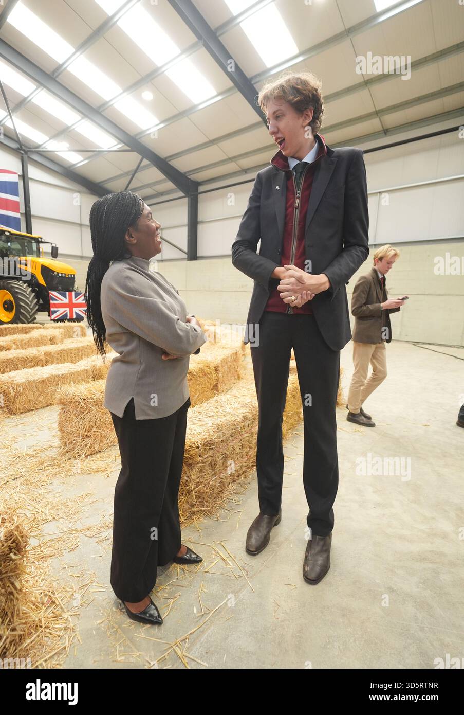 Conservative Party leader Kemi Badenoch speaks to student James ...