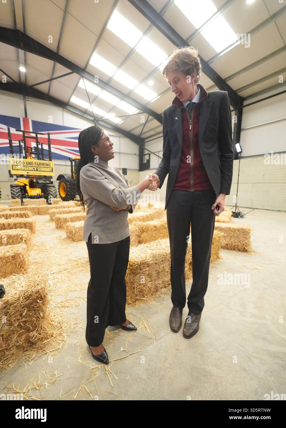 Conservative Party leader Kemi Badenoch speaks to student James ...