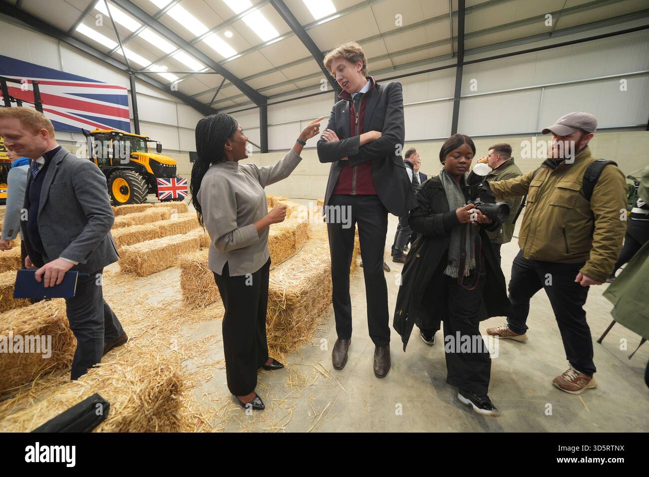 Conservative Party leader Kemi Badenoch speaks to student James ...