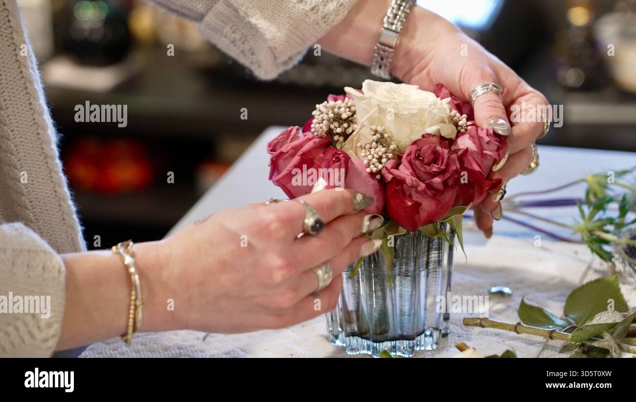 Megan Feller arranges bouquets for a Halloween party at her apartment ...