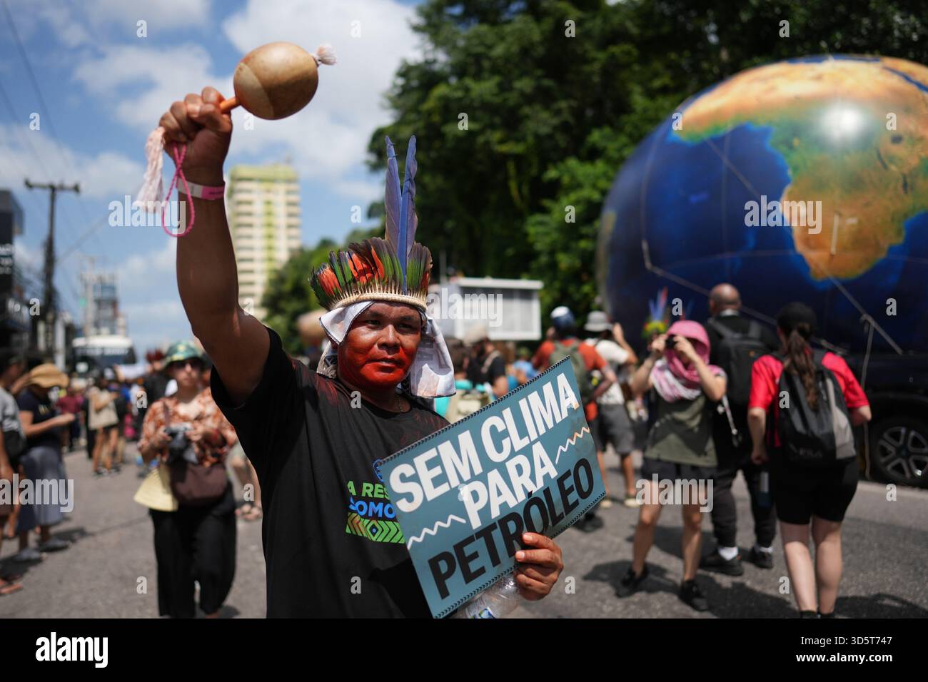 Indigenous activists participate in a climate protest during the COP30 ...