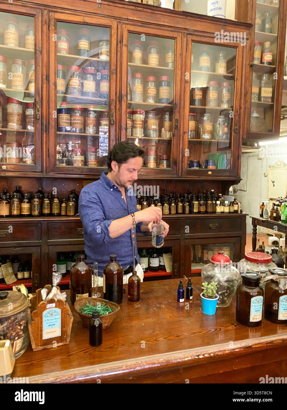 A local artist being served by Dr Alessandro Bizzarri, owner of ...