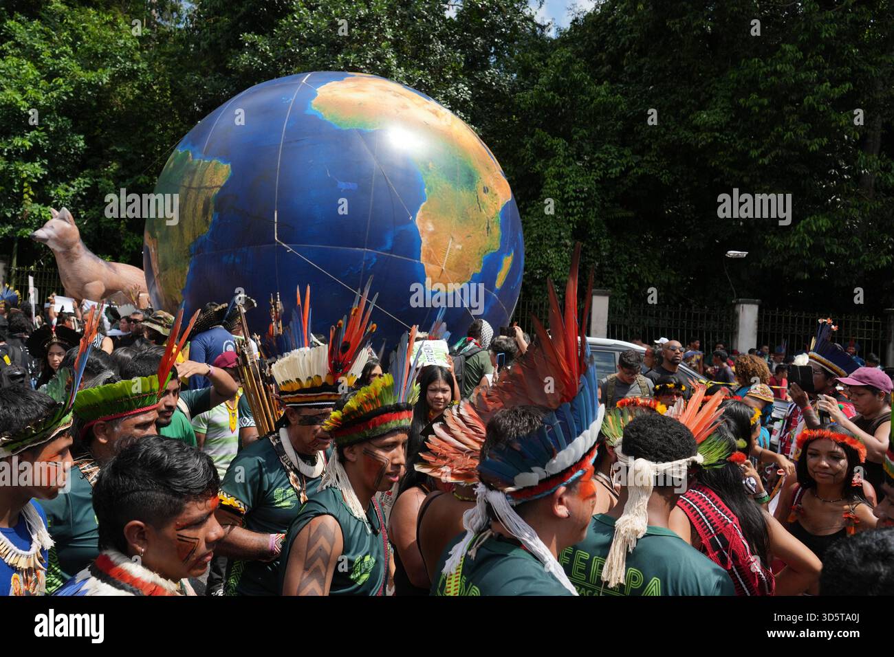 Indigenous activists participate in a climate protest during the COP30 ...
