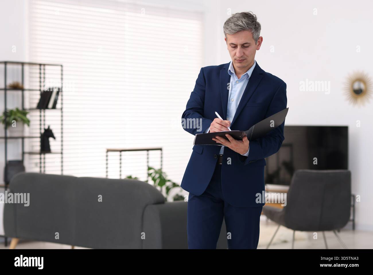 Real estate appraisal. Inspector with folder conducting property ...