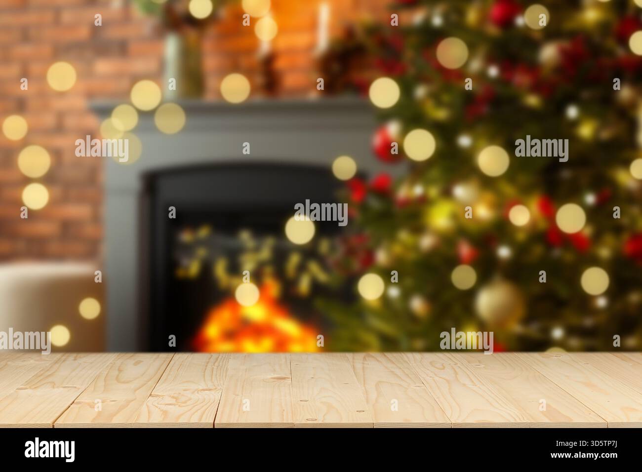 Empty wooden table against blurred room with Christmas tree, bokeh lights. Space for design ...