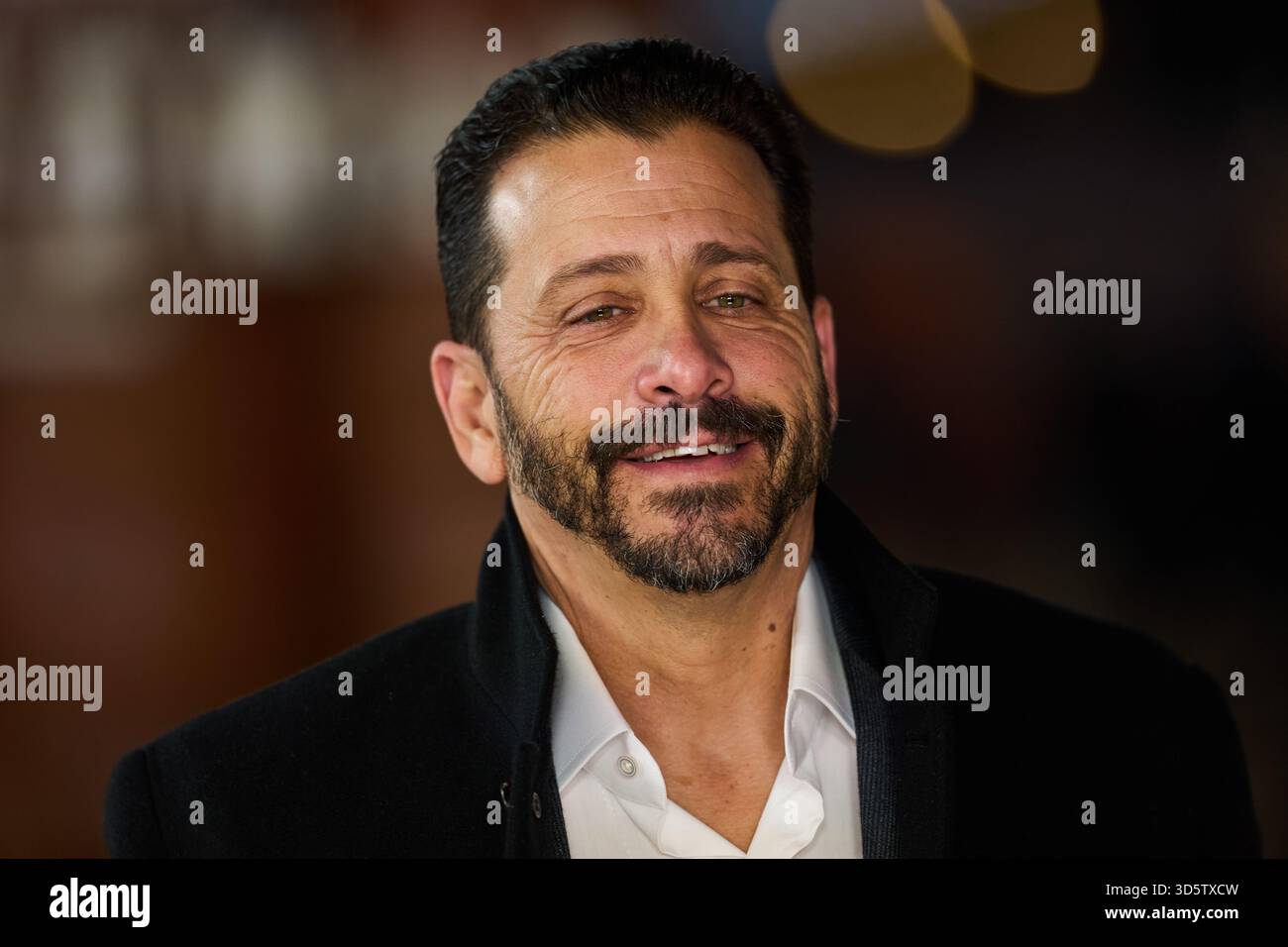 David Glasser poses for photographers upon arrival at the UK premiere ...