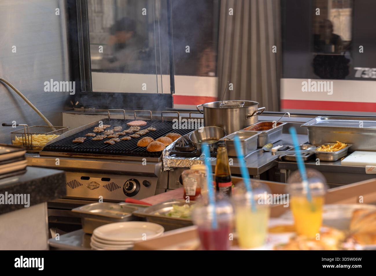 17 November 2025, Turkey, Istanbul: People walk past a street food ...