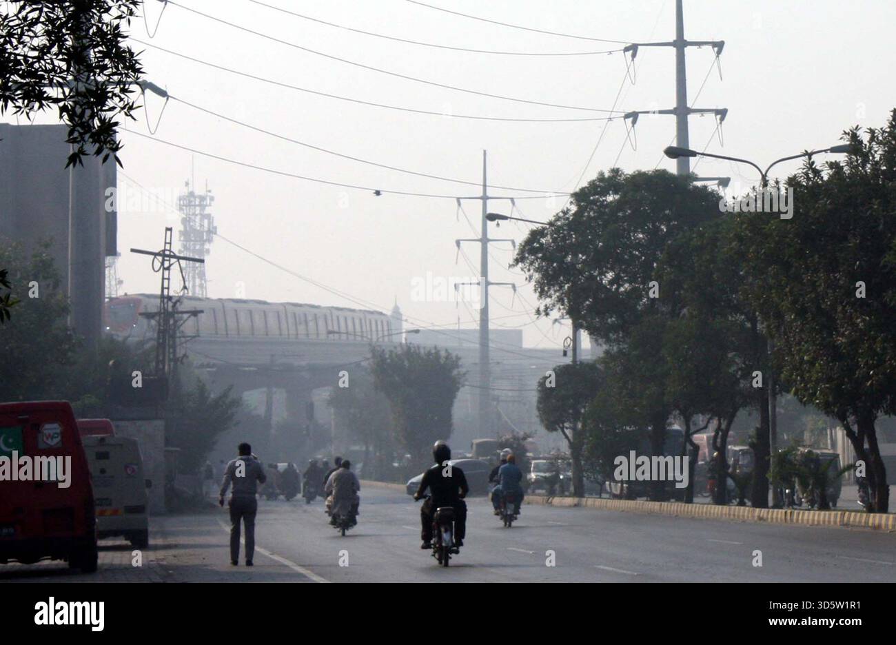 LAHORE, PAKISTAN, NOV 17: Deep fog covers the horizon of city creating ...