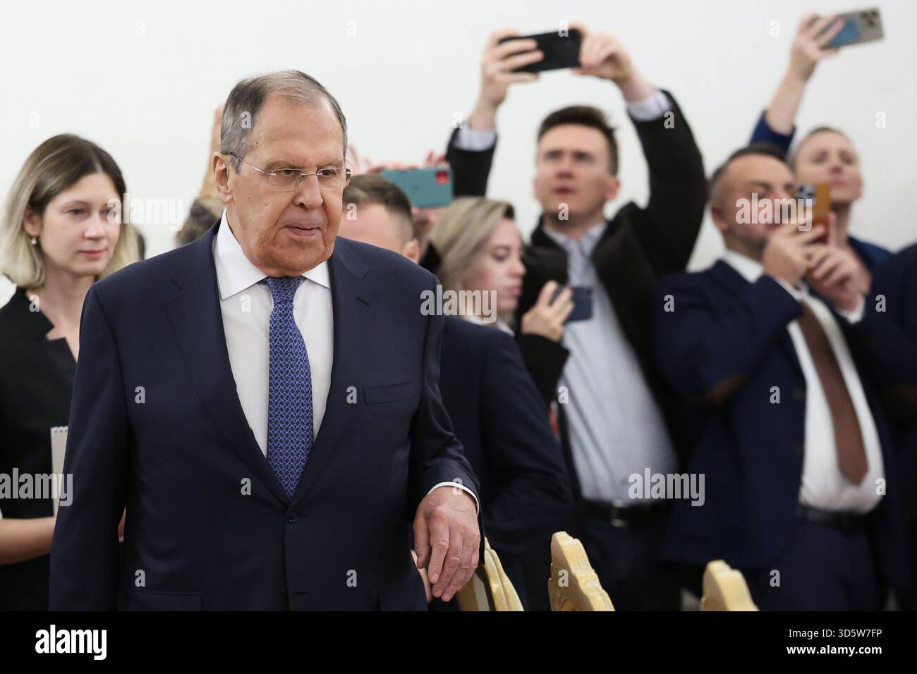 Russian Foreign Minister Sergey Lavrov enters a hall for his talks with ...