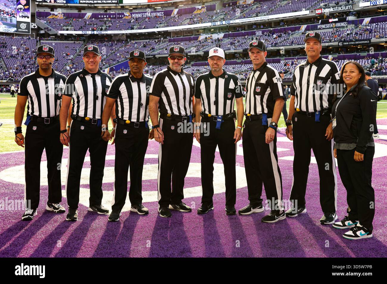 Officials, from left to right, back judge Greg Yette (38), field judge ...