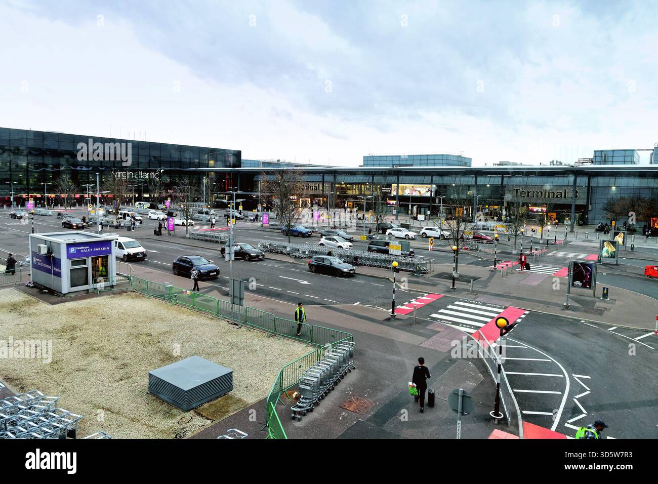 An elevated view of the Drop Off Zone for cars outside Terminal Three ...