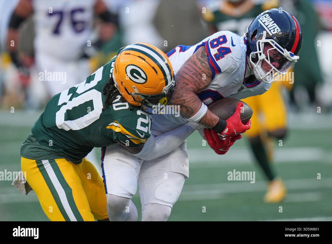 Green Bay Packers' Javon Bullard, left, tackles New York Giants' Theo ...