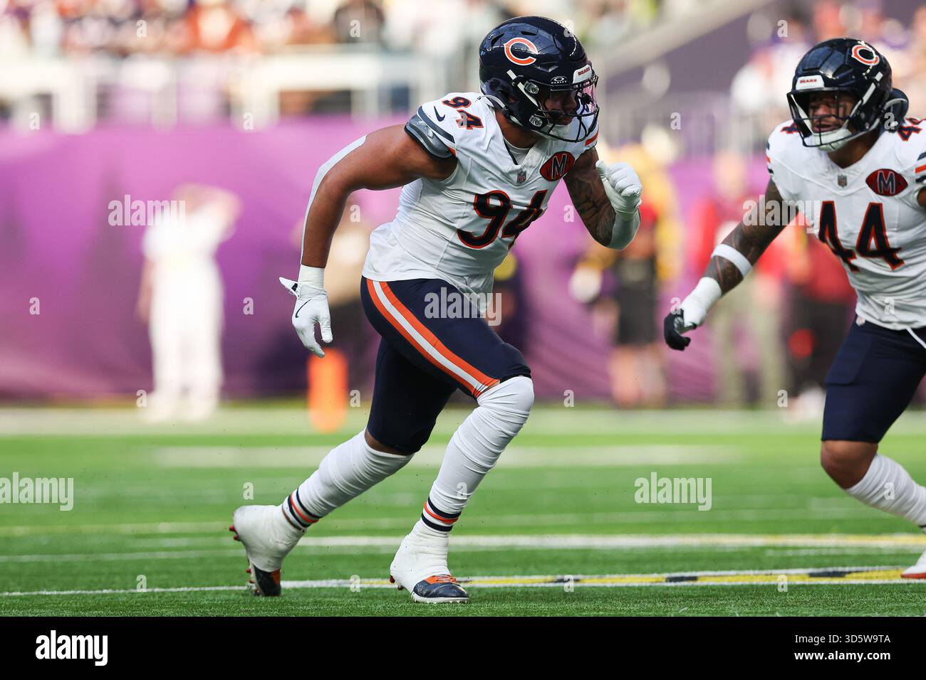 Chicago Bears defensive end Austin Booker (94) moves across the field ...
