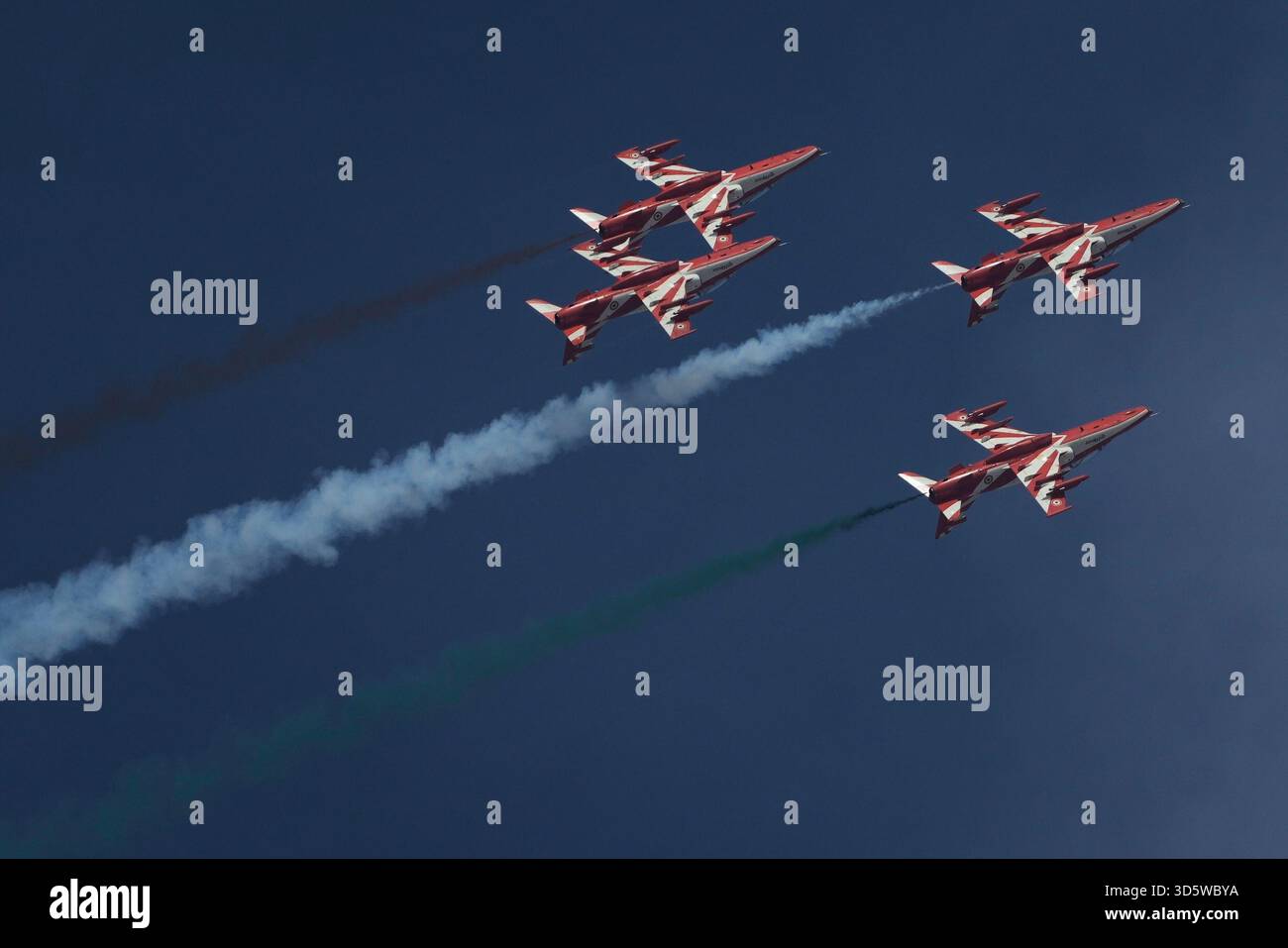 The Indian Air Force aerobatic demonstration team Surya Kiran performs during the opening day of ...