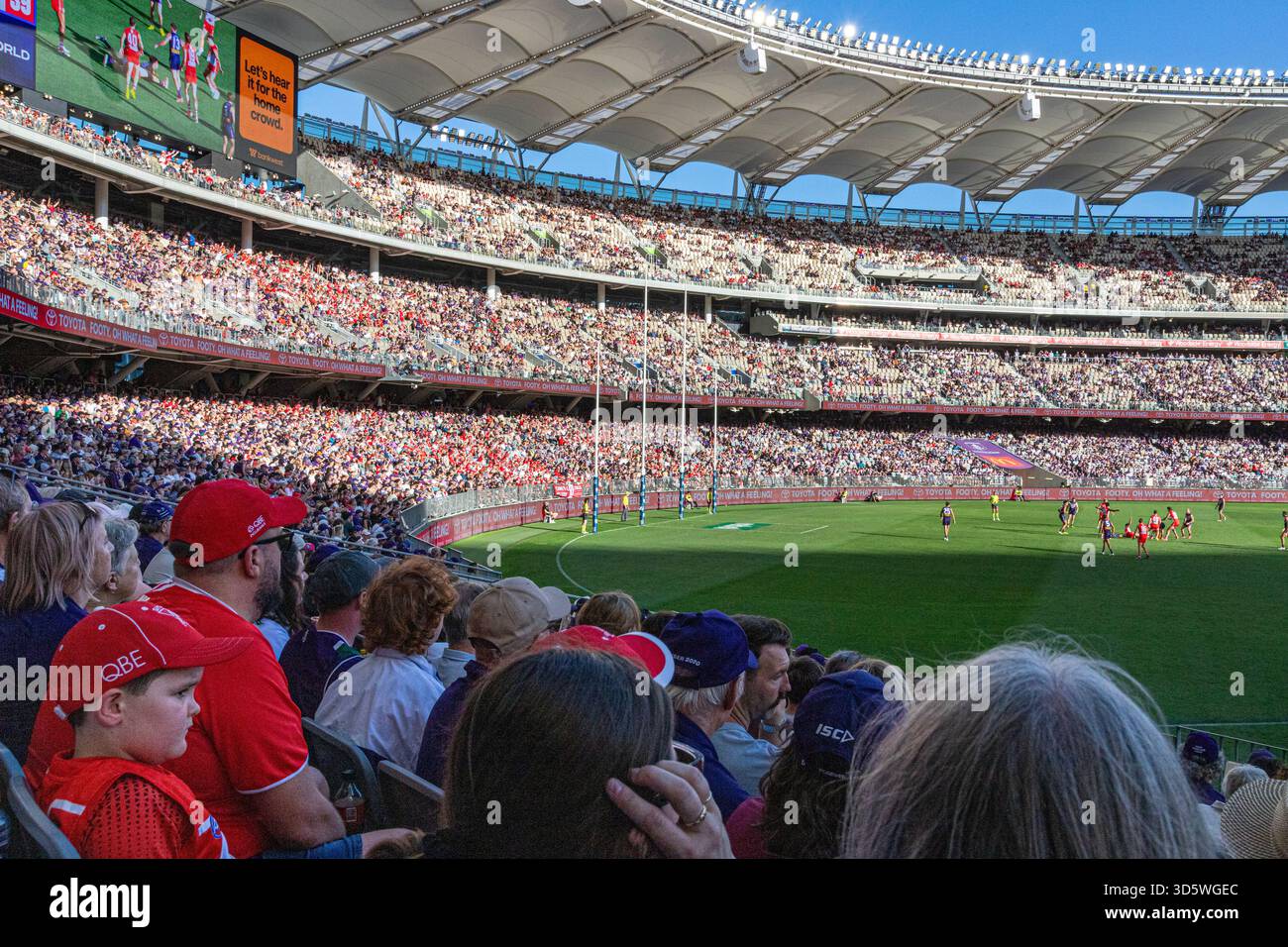 Fans watching Fremantle Dockers play the Sydney Swans at Aussie Rules ...