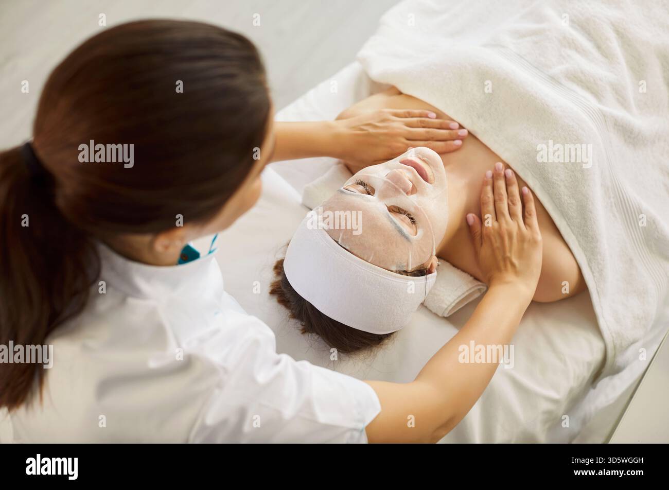 Woman lying peacefully, medical treatment bed, female client receiving ...